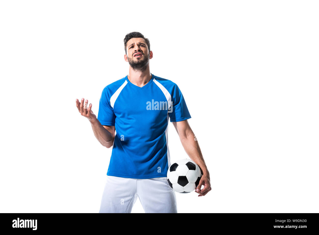 displeased soccer player with ball Gesturing Isolated On White Stock ...