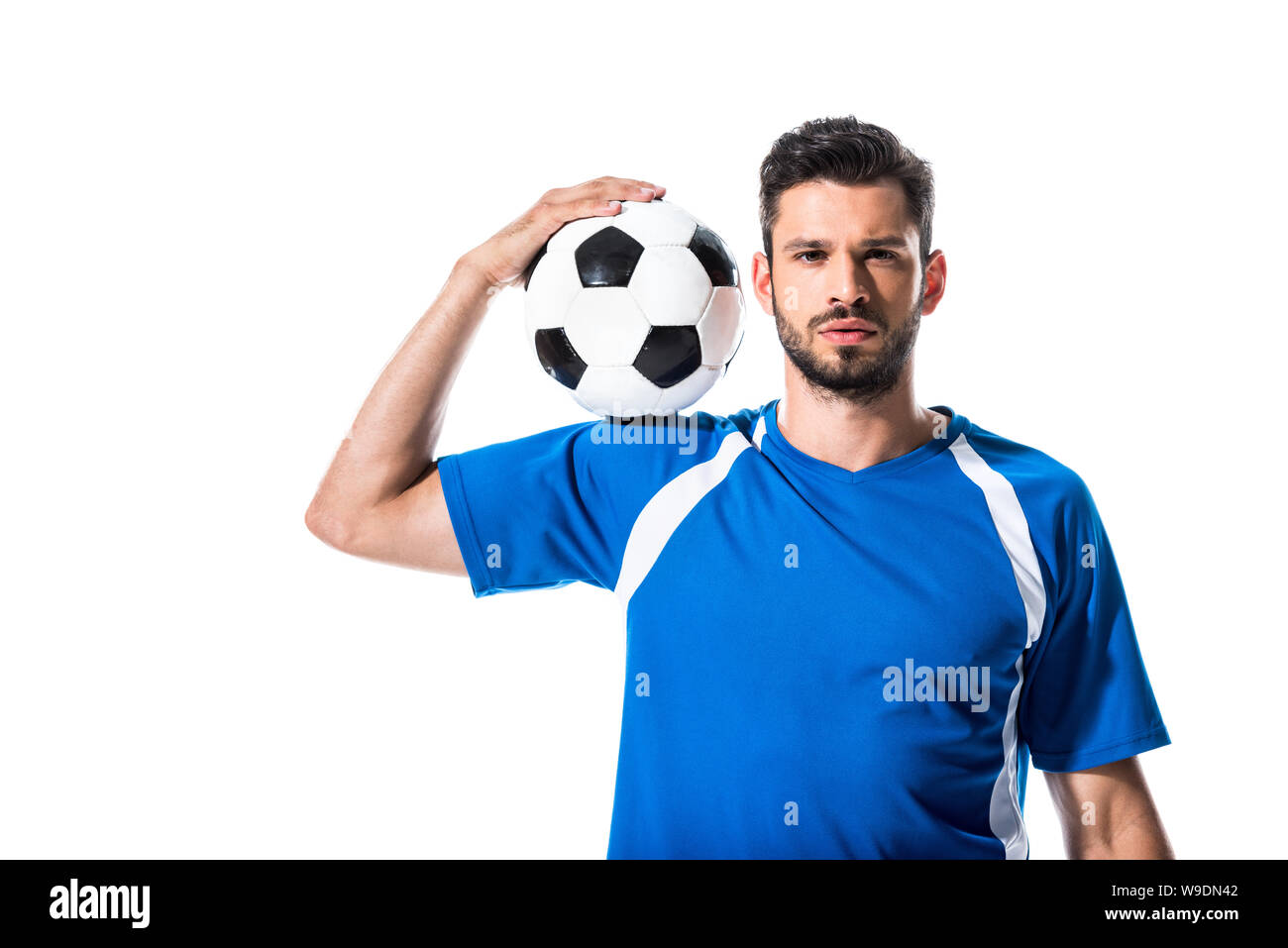 handsome soccer player looking at camera and holding ball Isolated On ...