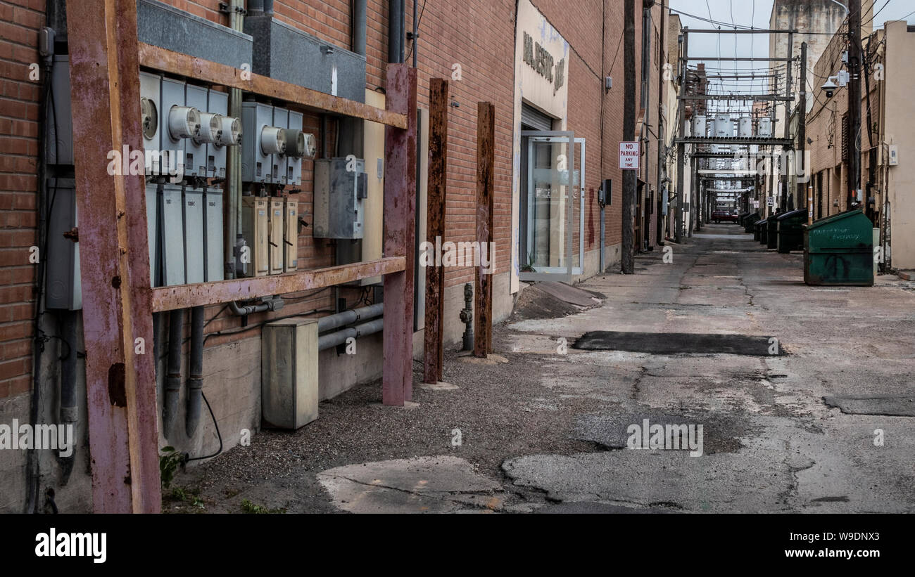 Looking down an alleyway with wires and cables, Texas, USA Stock Photo ...