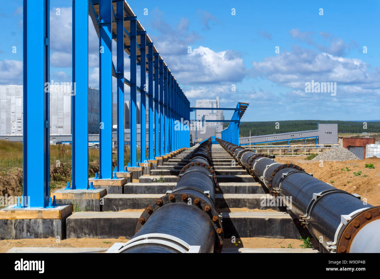 industrial pipeline that goes into perspective to the above-ground ...
