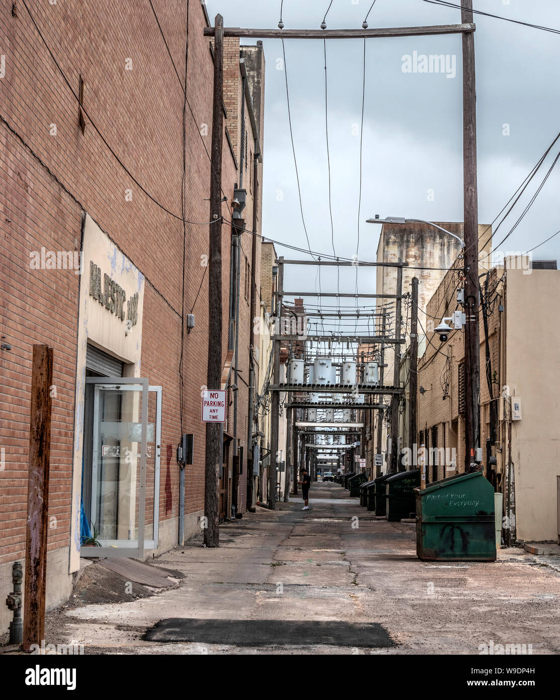 Looking down an alleyway with wires and cables, Texas, USA Stock Photo ...