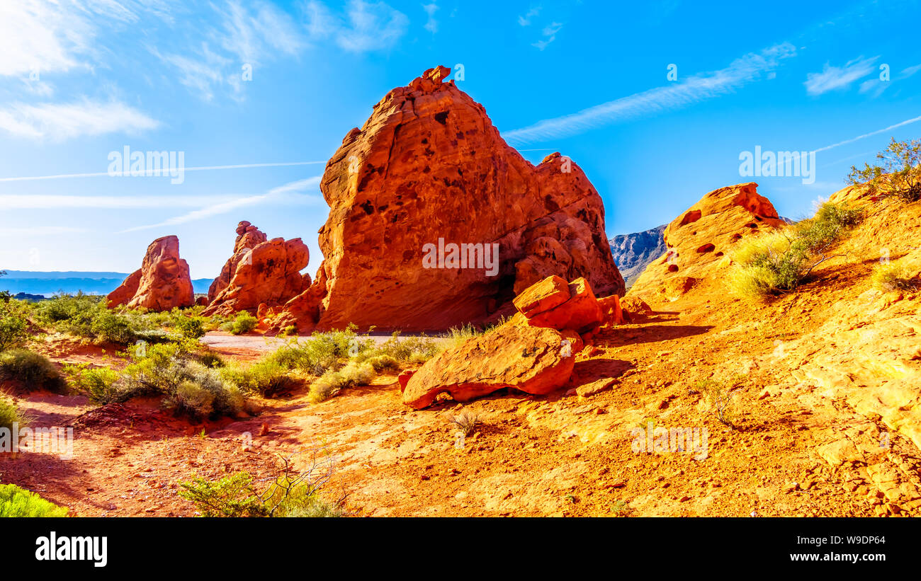 Sunrise over the bright red Aztec sandstone rock formation of the Seven ...