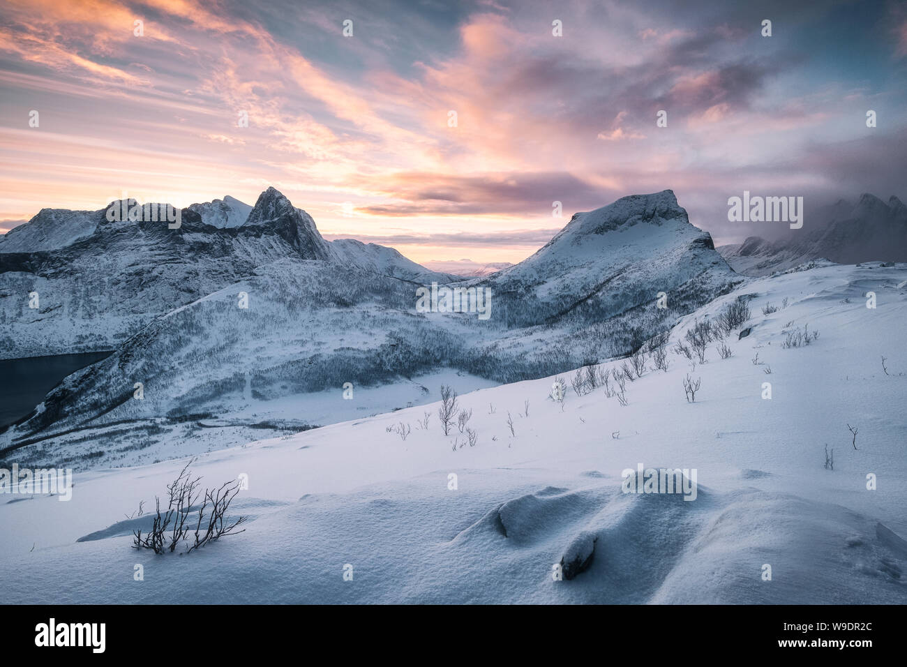 Landscape of Snowy mountain with colorful sky at sunrise. Segla island ...