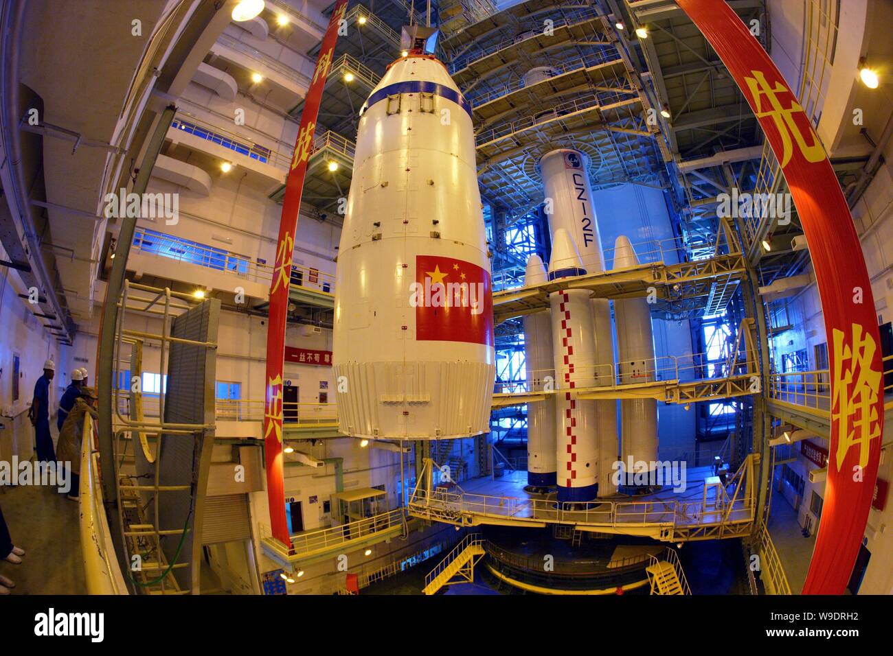 Chinese aeronautical scientists and workers unload the Shenzhou VII ...