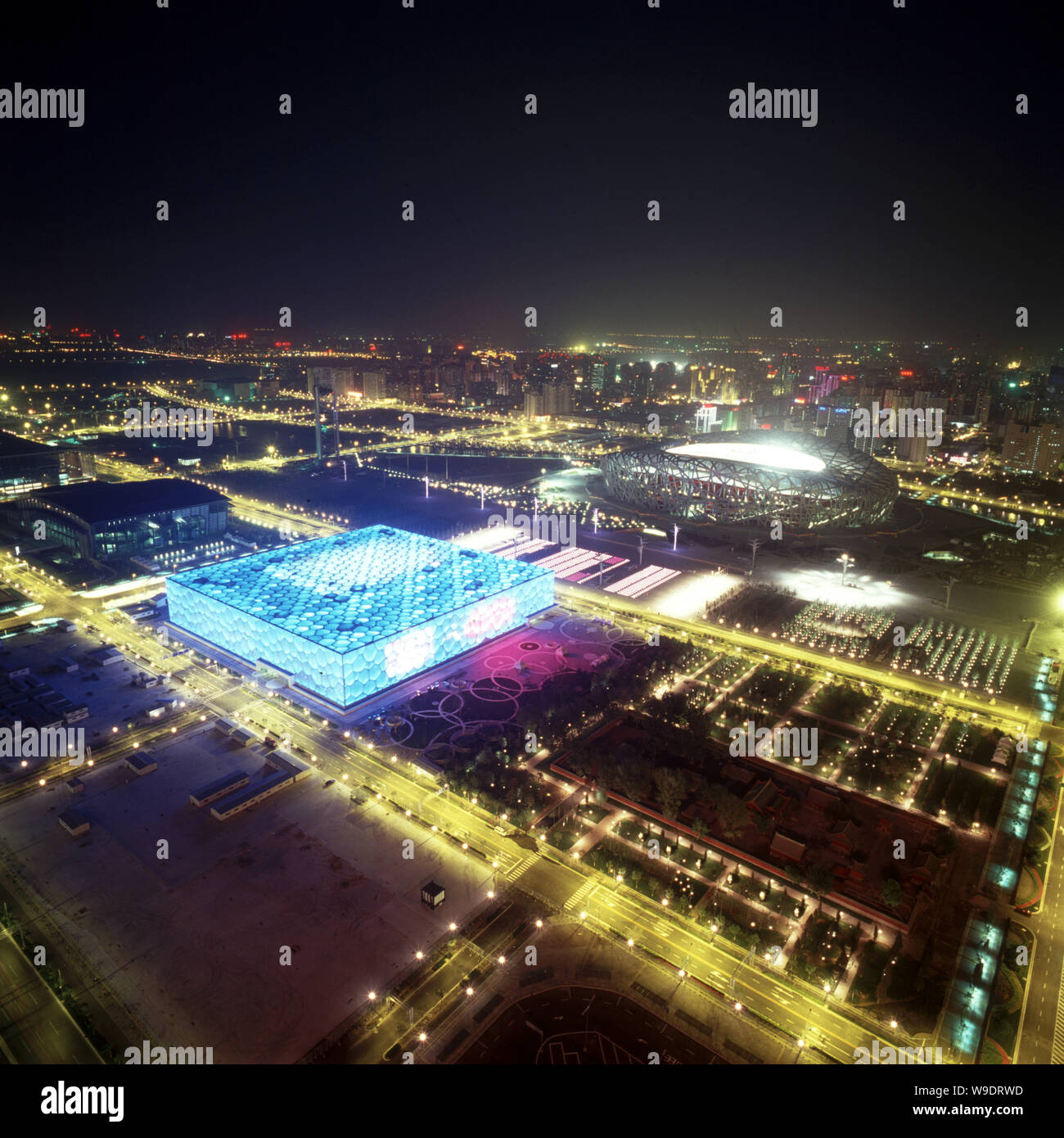 Night view of the National Aquatic Center, front, known as the Water ...