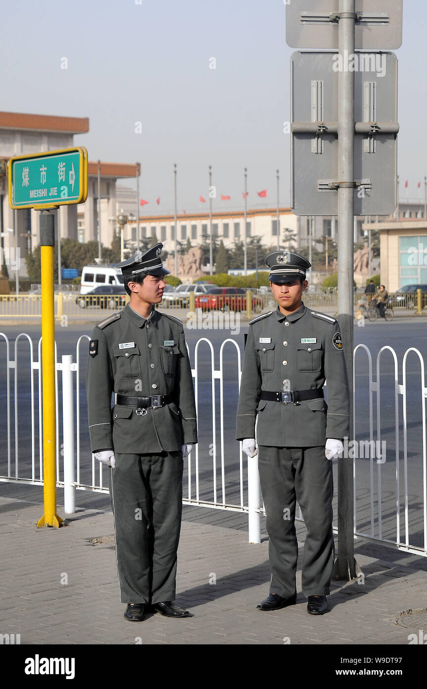 --FILE-- Chinese securities stand guard on Tiananmen Square in Beijing ...
