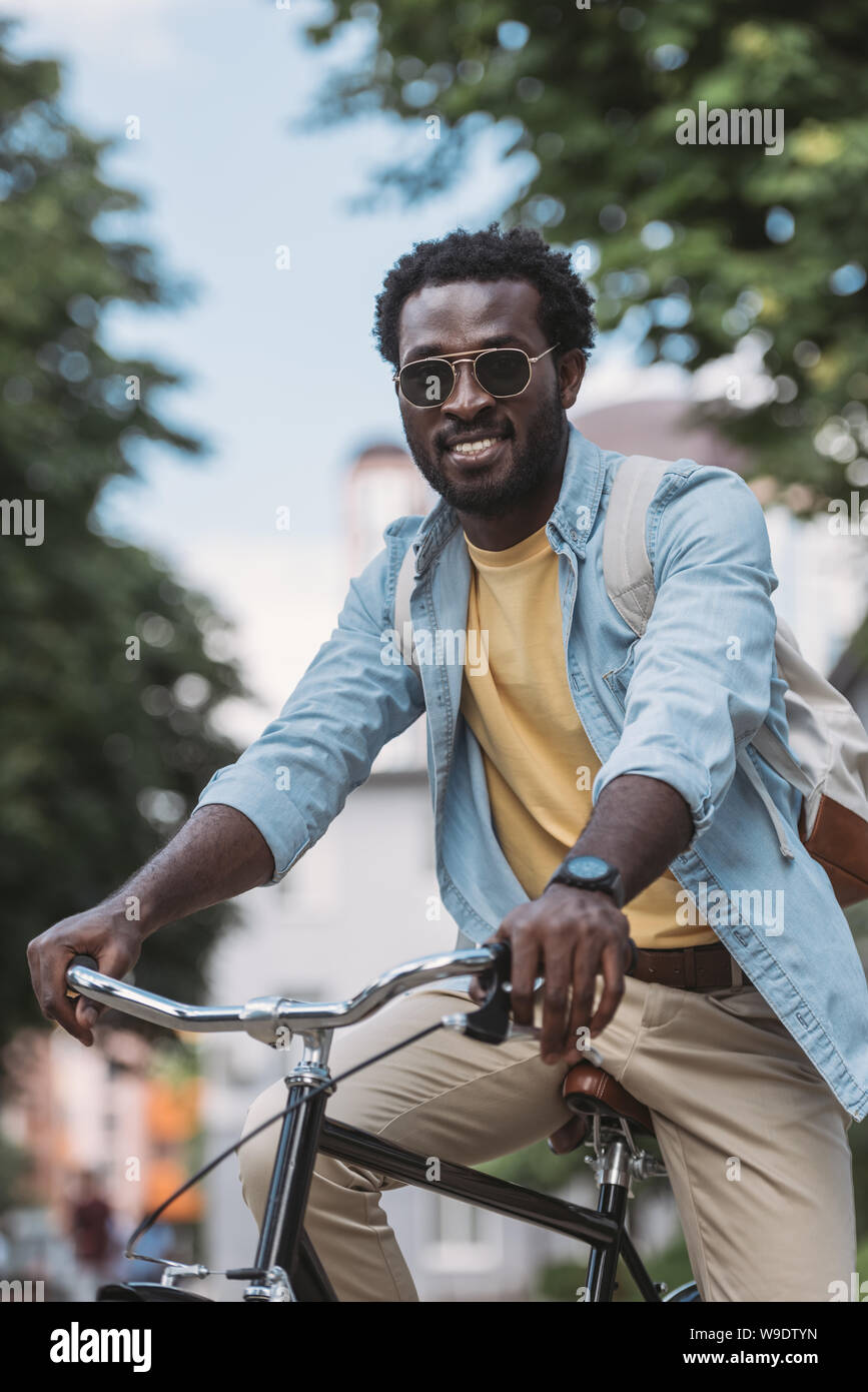 Man cheerful smile ride bicycle hi-res stock photography and images - Alamy