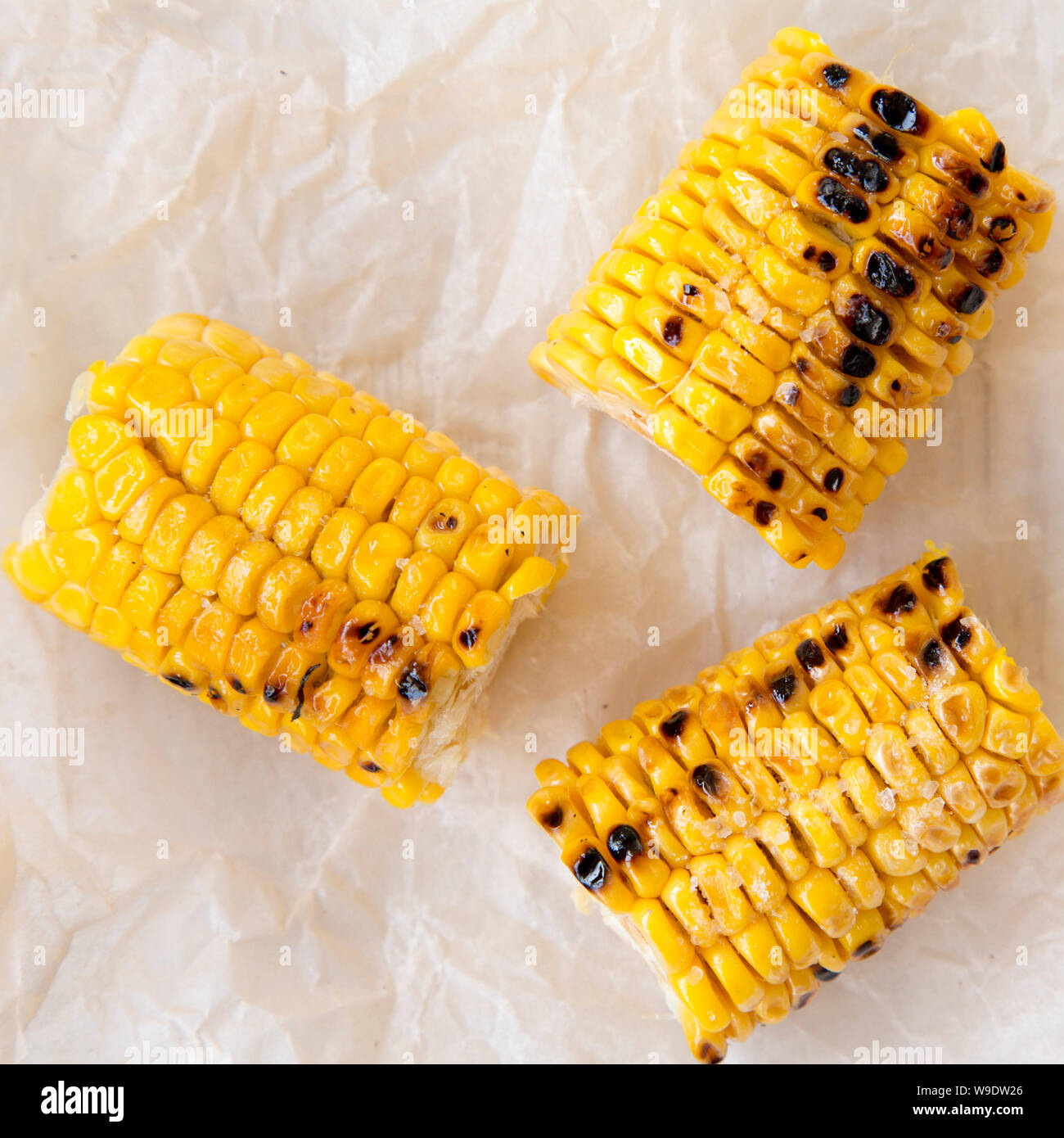 Grilled corn on the cob, close-up. Summer food. Overhead, top view ...