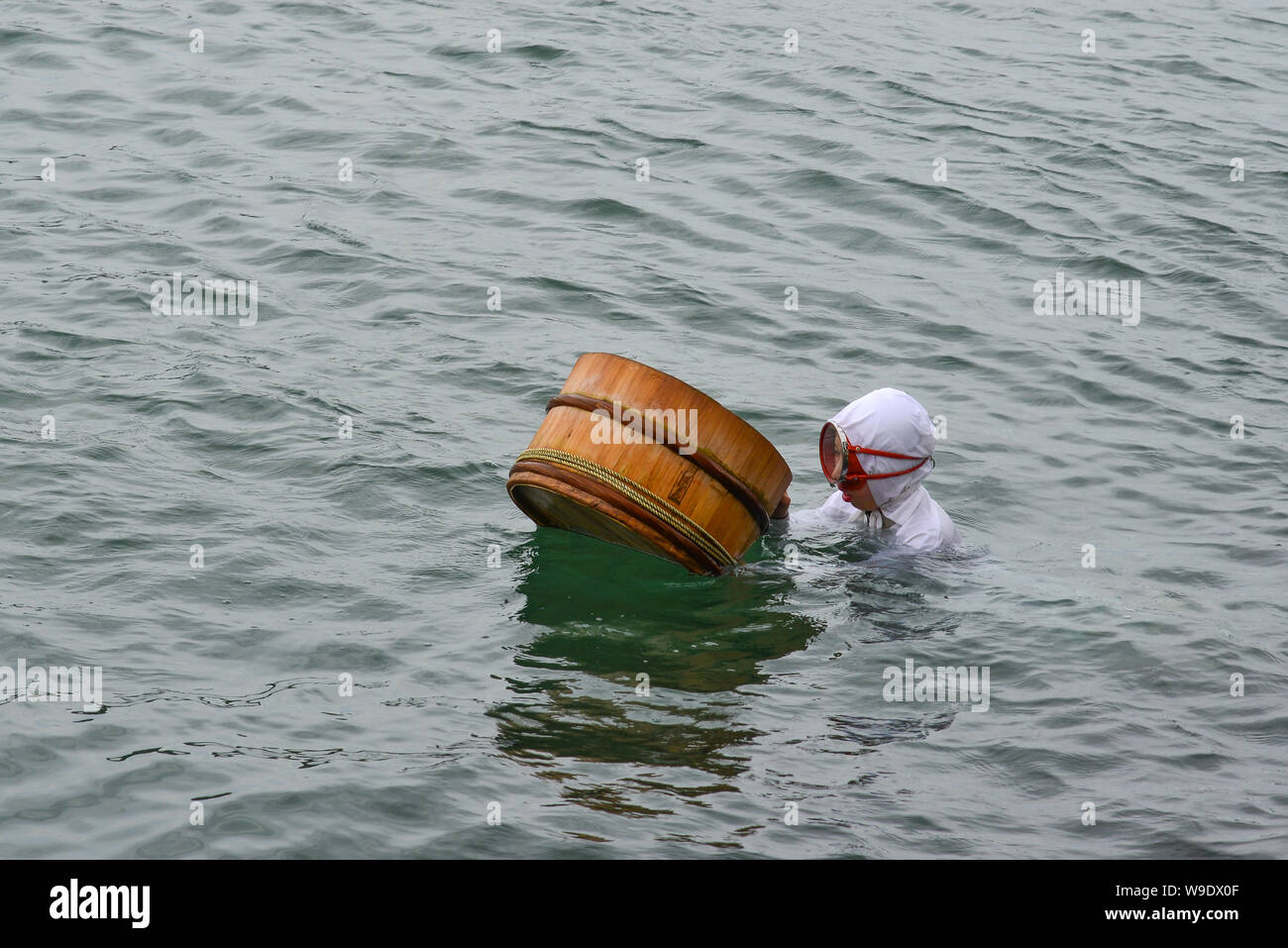 Toba, Japan - Mar 18, 2018. An Ama female diver working on the sea in ...