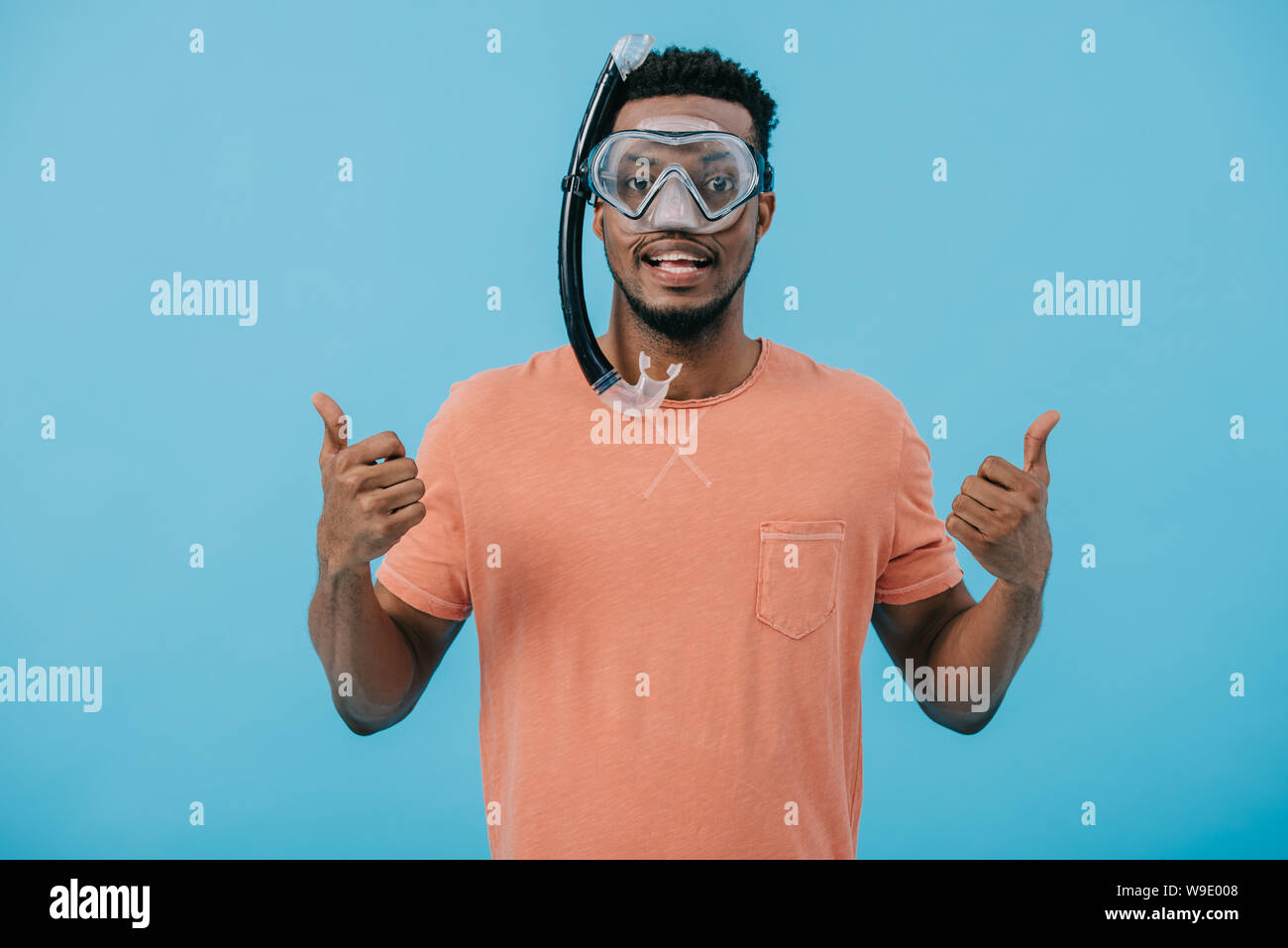 happy african american man in diving mask showing thumbs up isolated on ...