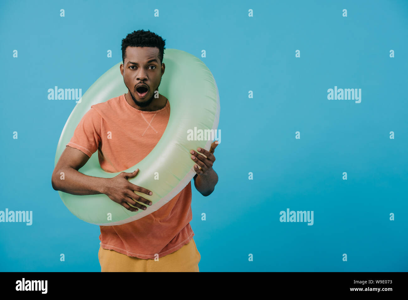 Surprised man inflatable ring hi-res stock photography and images - Alamy