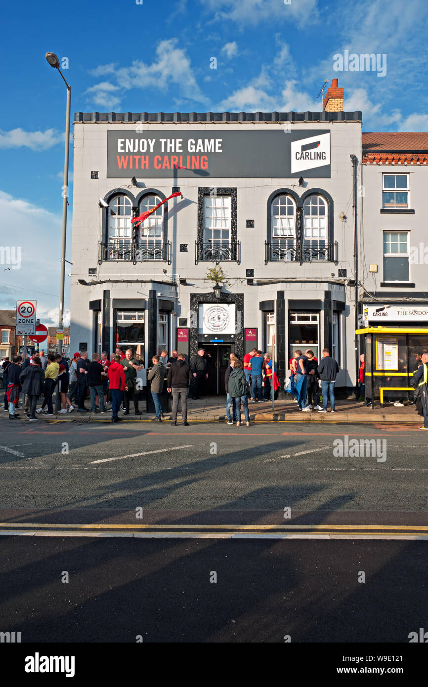 Supporters gather outside The Sandon pub near Liverpool's Anfield ...
