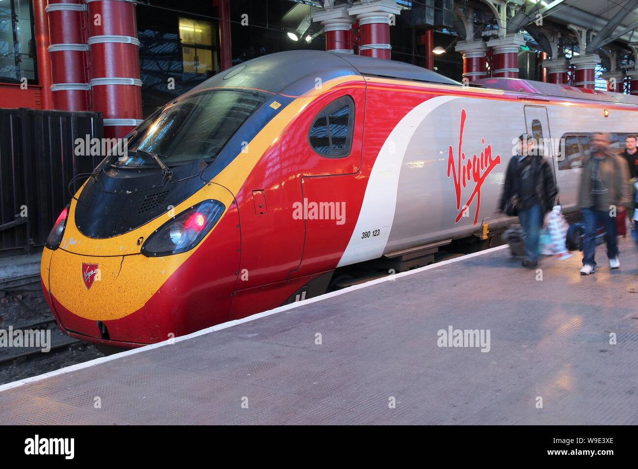 LIVERPOOL, UK - APRIL 20, 2013: People alight Virgin Trains Pendolino ...