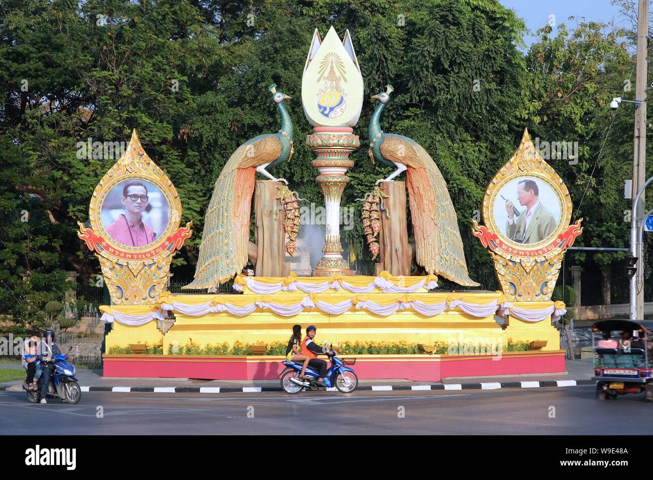 BANGKOK, THAILAND - DECEMBER 22, 2013: People ride along King Bhumibol ...