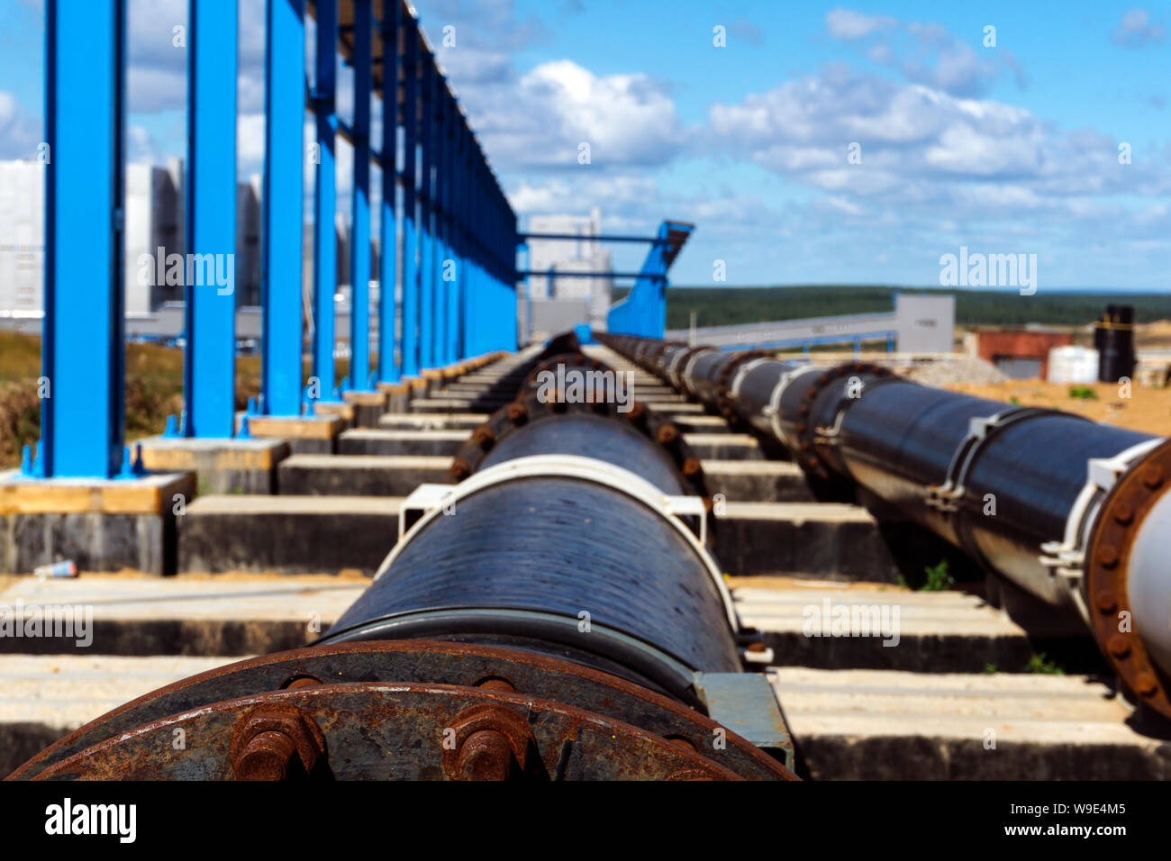 industrial pipeline that goes into perspective to the above-ground ...