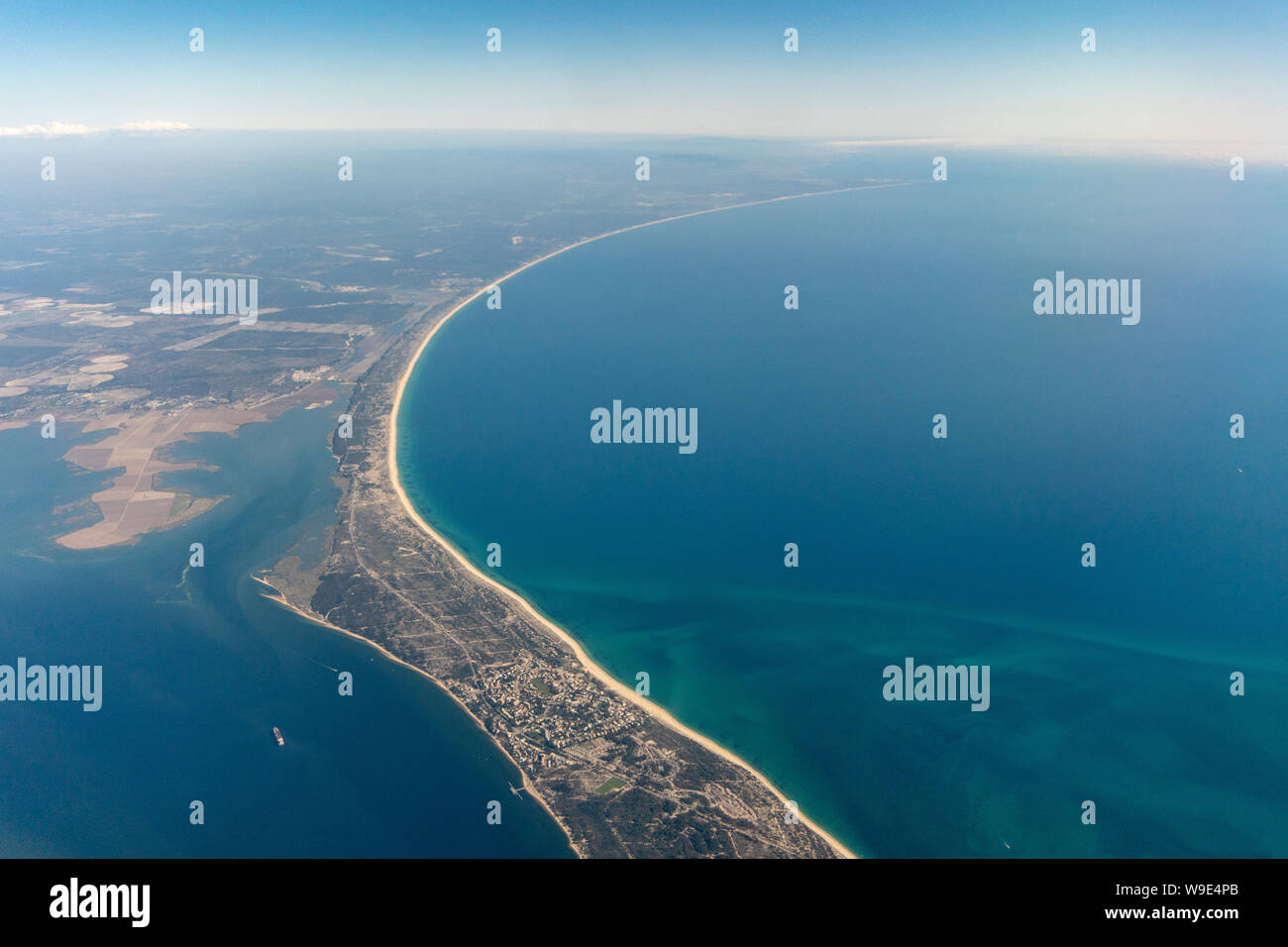 Aerial view of peninsula with beach between wetland Ria Formosa and ...