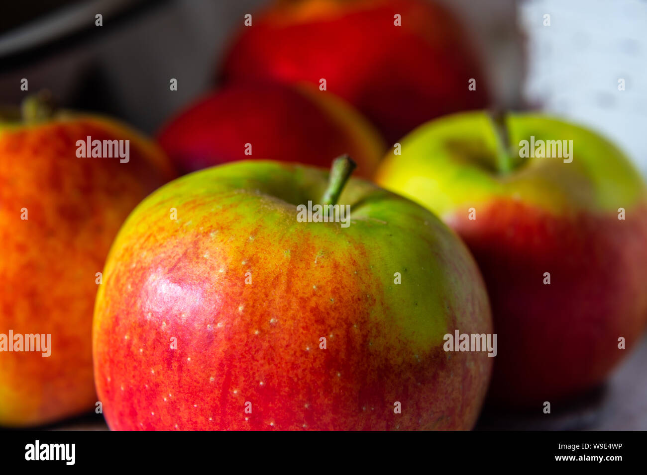 Fresh red, yellow and green apples background. Close up Stock Photo - Alamy