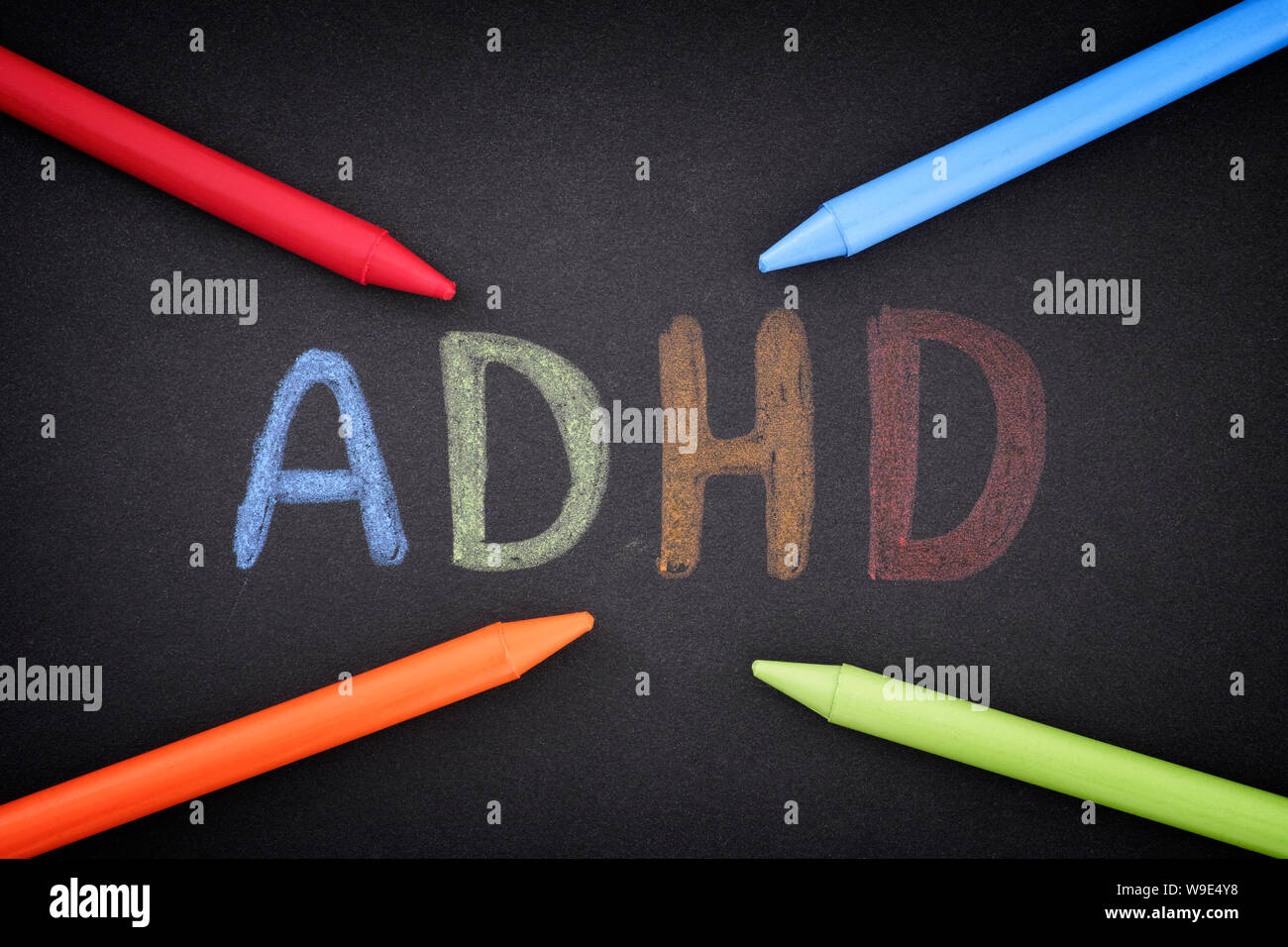 ADHD. Abbreviation ADHD on black background. Close up. ADHD is ...