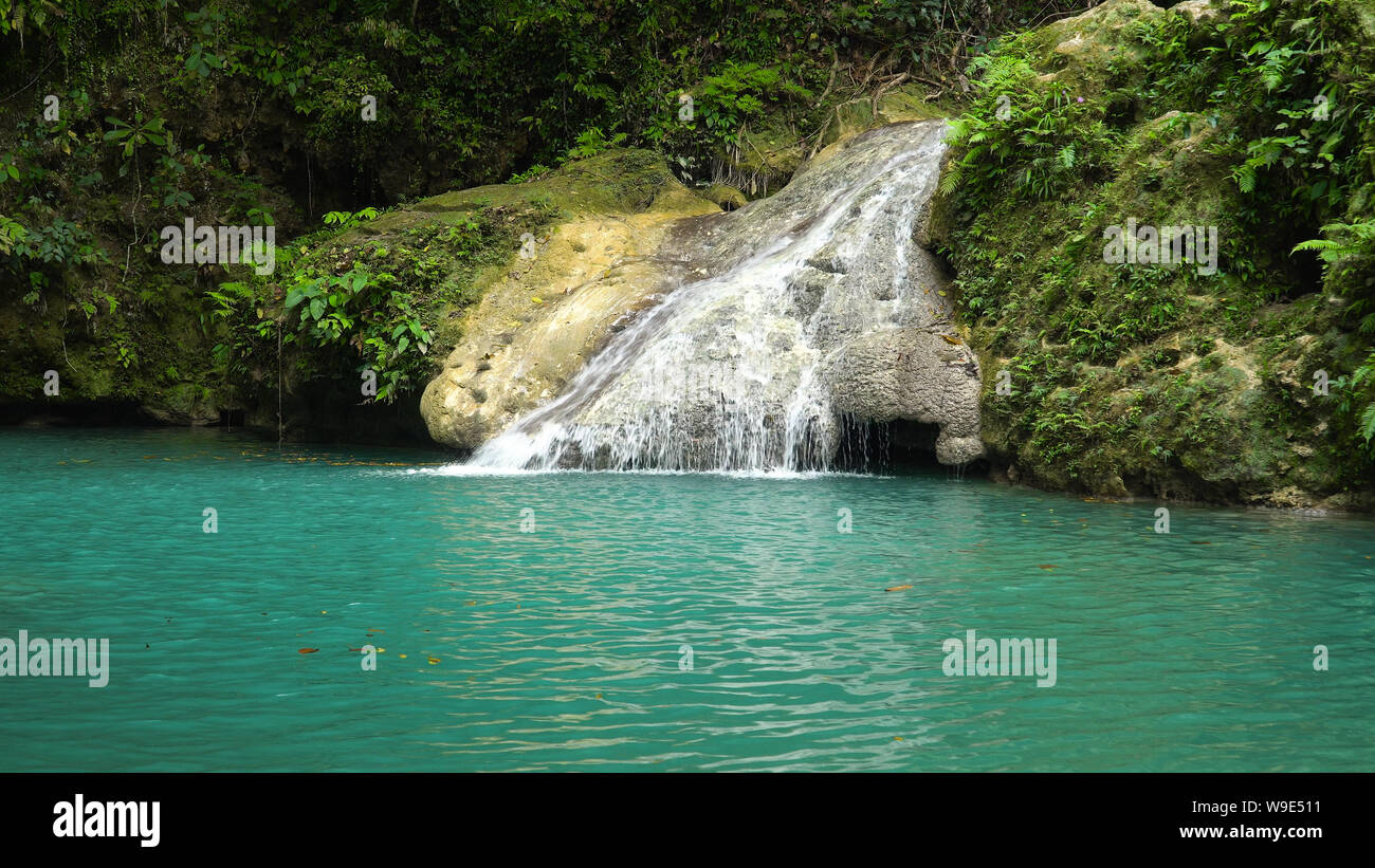 Waterfall in the rainforest jungle. Tropical Cambais waterfalls in ...