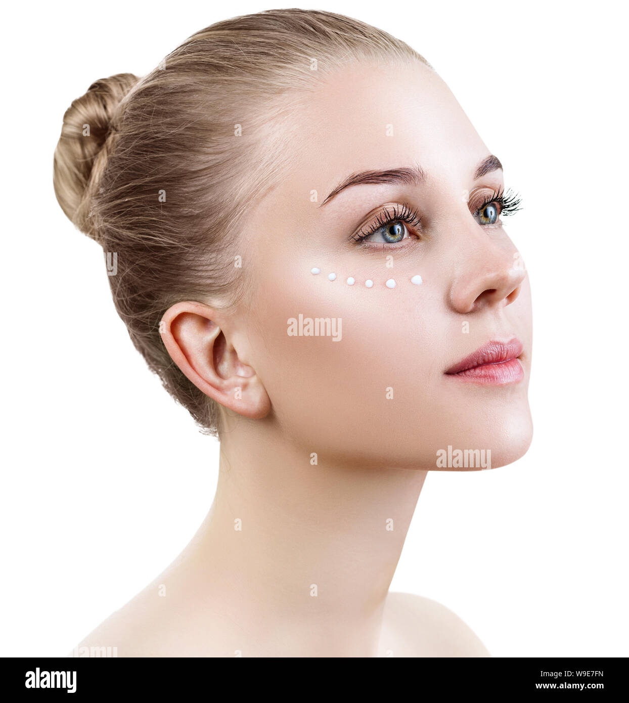 Sensual woman with cream dots on face Stock Photo - Alamy