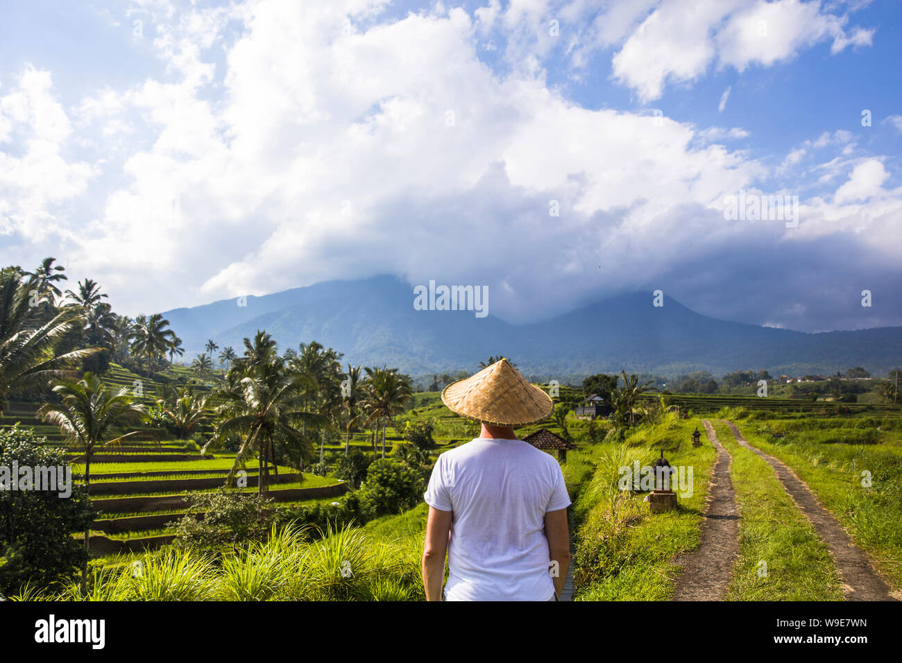 Man with traditional balinese cap at rice fields of Jatiluwih in ...