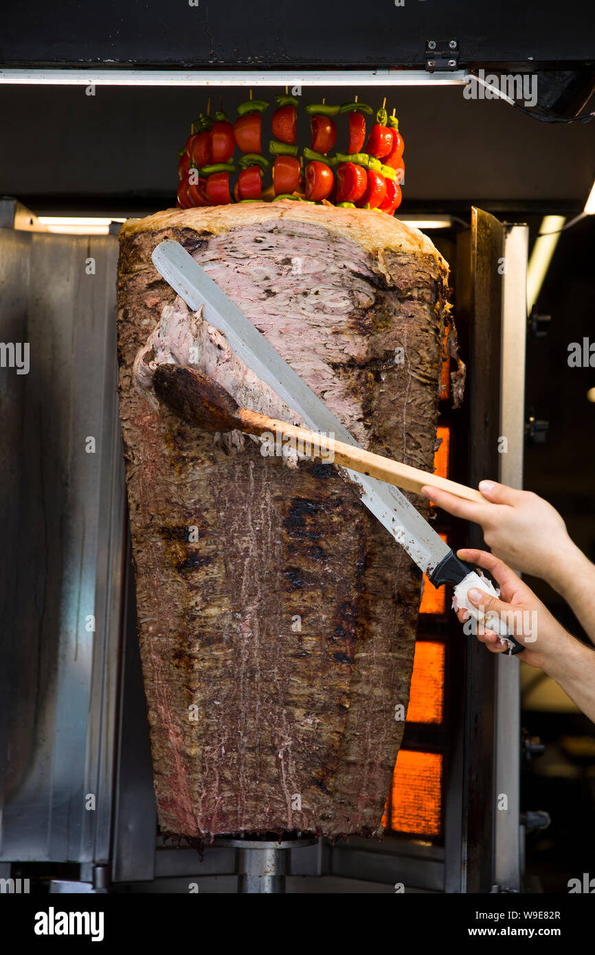 View at arm moving to cut the kebab meat on the market in Istanbul ...