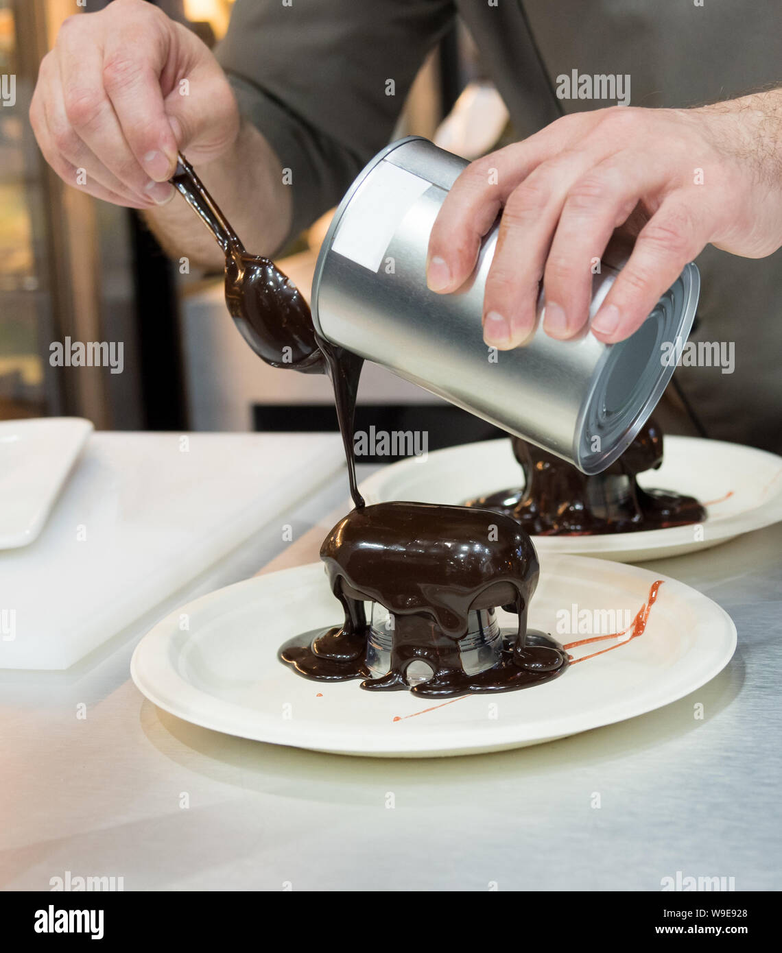 Pastry chef decorating, chef preparing desert chocolate cake Stock ...