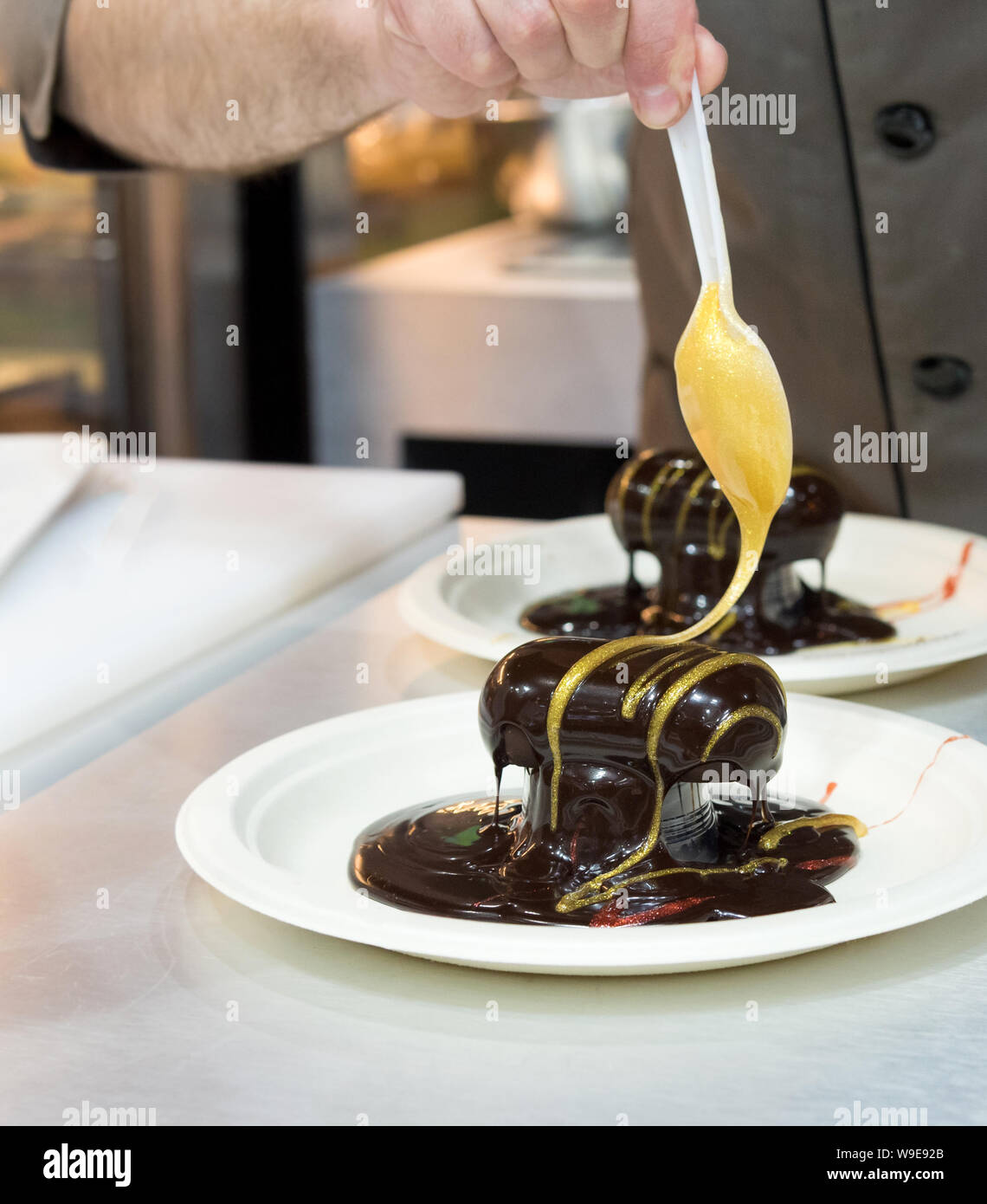 Pastry chef decorating, chef preparing desert chocolate cake Stock ...