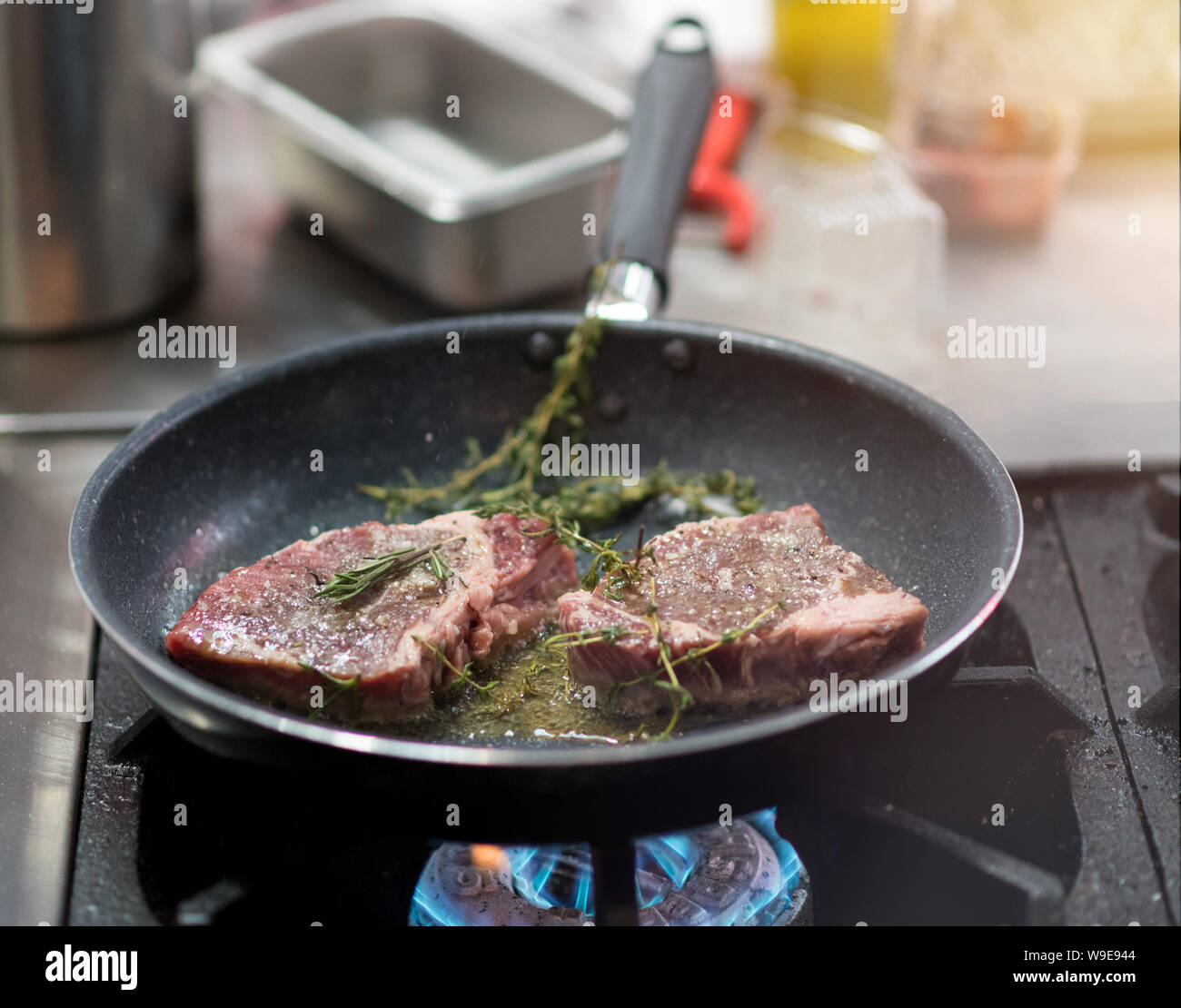 Frying Steak on Pan, Steak in the pan in the Kitchen Stock Photo - Alamy