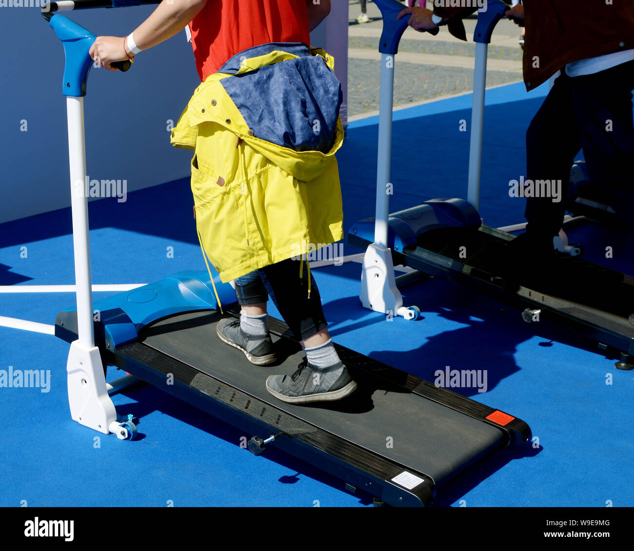 Athlete trains on a simulator.Running with adjustable muscle load Stock ...