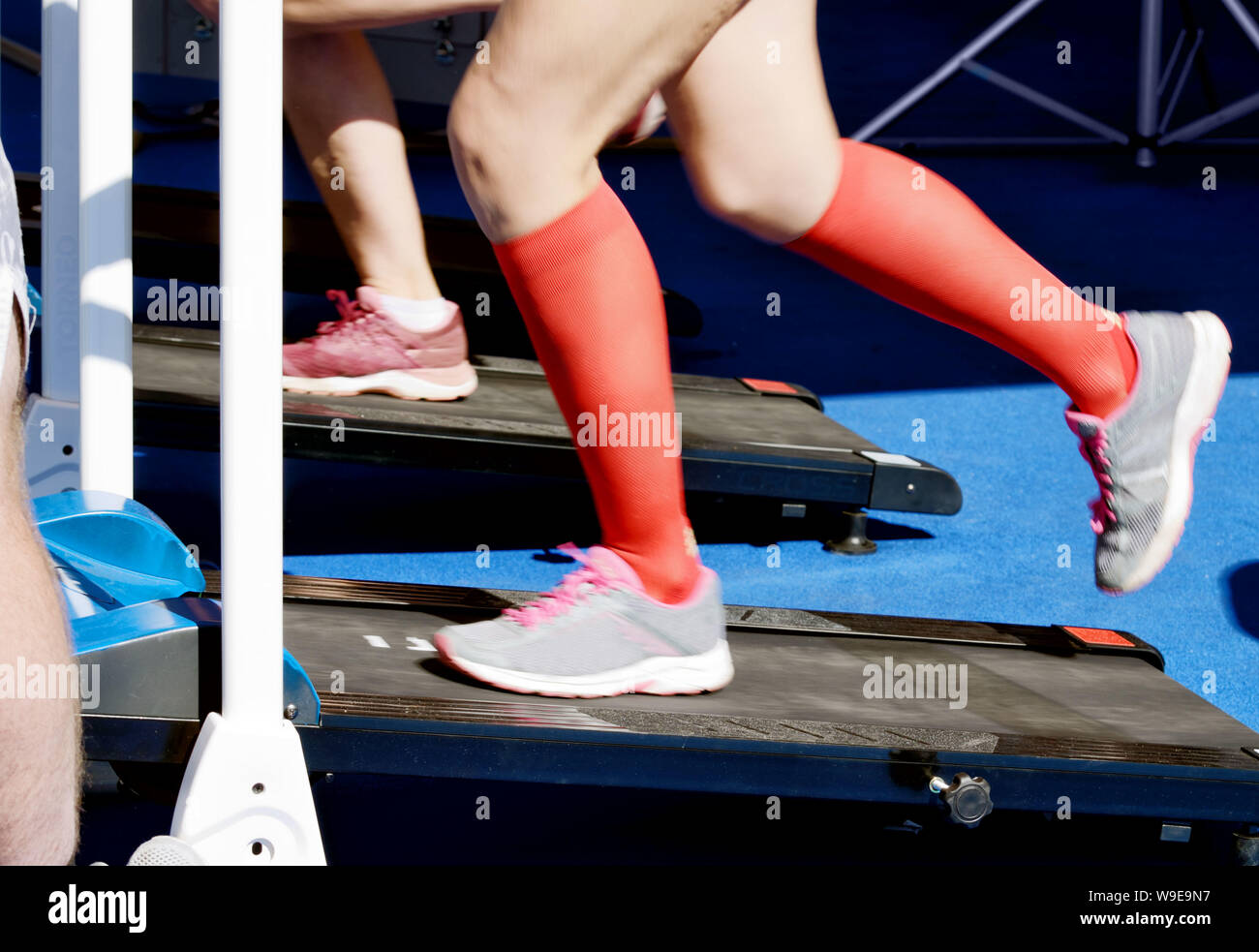 Athlete trains on a simulator.Running with adjustable muscle load Stock ...