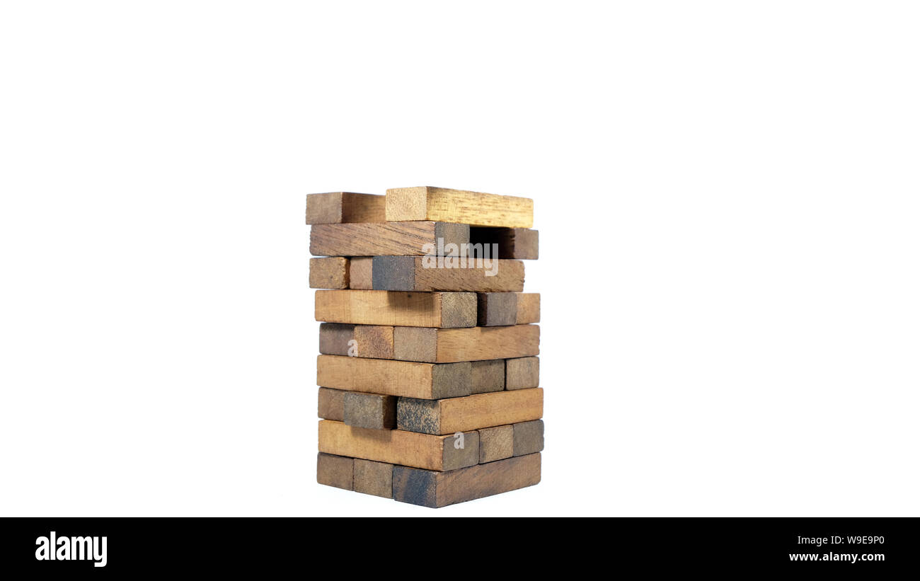Construction of the tower Jenga games on a white background Stock Photo ...