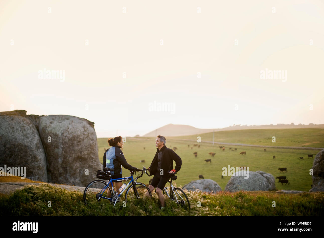 Mature cyclists taking a break and talking Stock Photo - Alamy