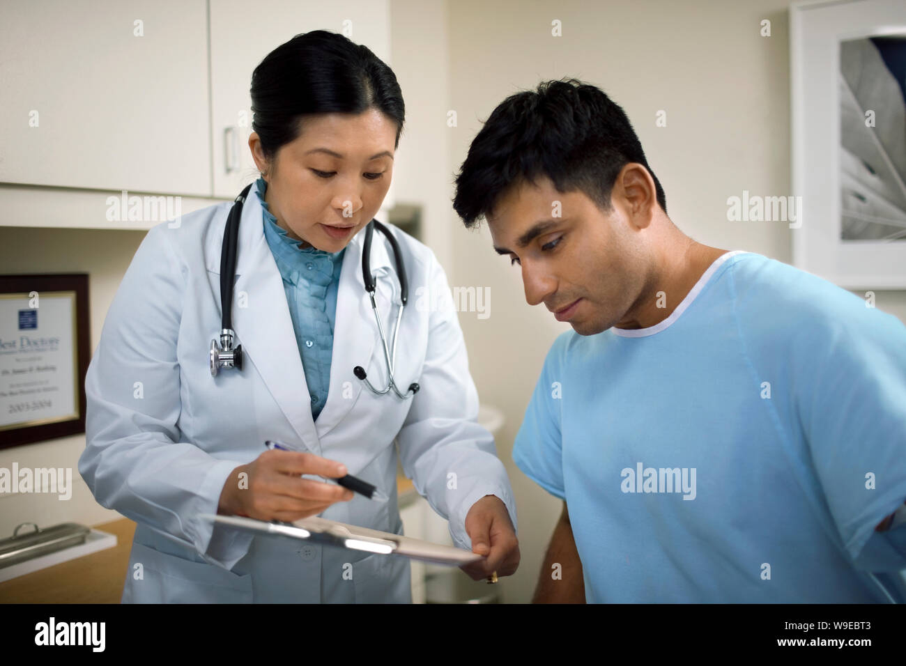 Female doctor consulting with a patient after a medical examination in ...