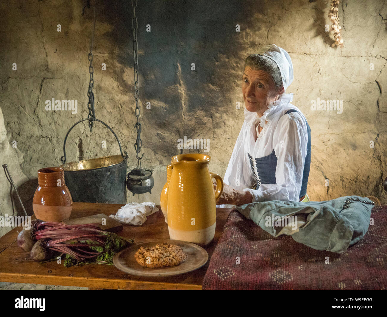 Pilgrim woman in her home Stock Photo - Alamy