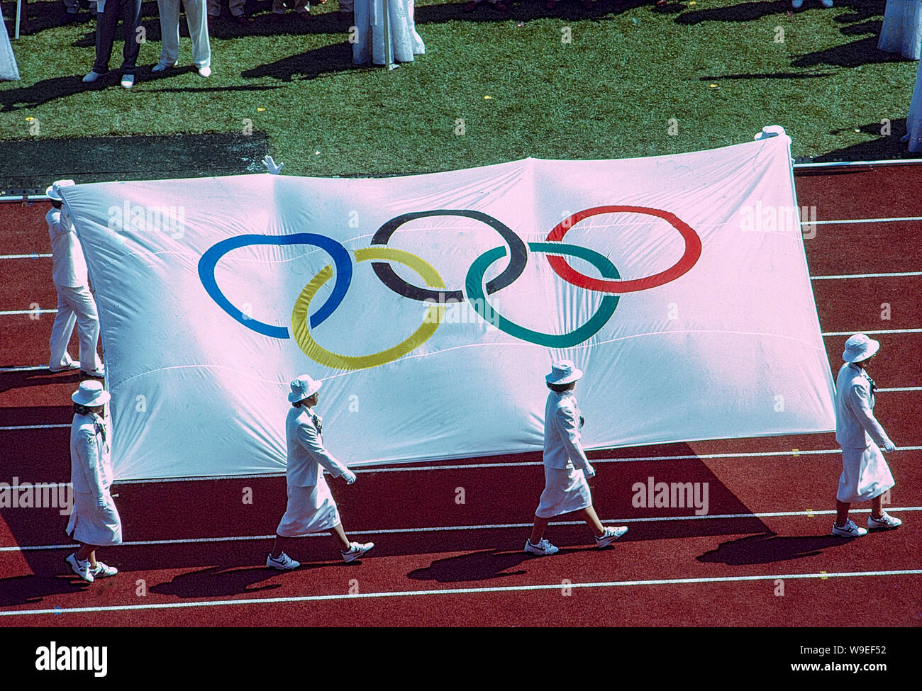 Olympic flag being carried in at the 1988 Olympic Summer Games Stock Photo - Alamy