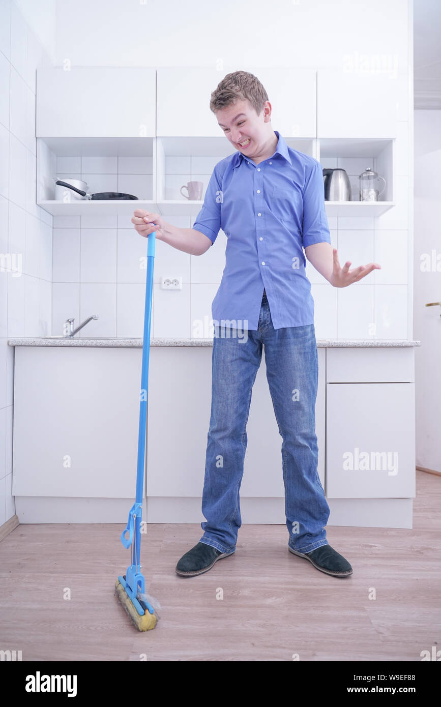 Teen boy washing up hi-res stock photography and images - Alamy