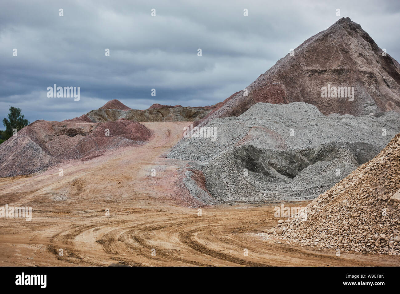Industrial quarry with mountains of sand and rubble Stock Photo - Alamy