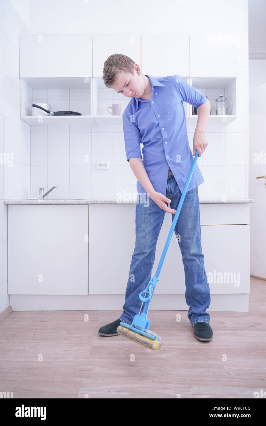 Boy cleaning floor cloth hi-res stock photography and images - Alamy