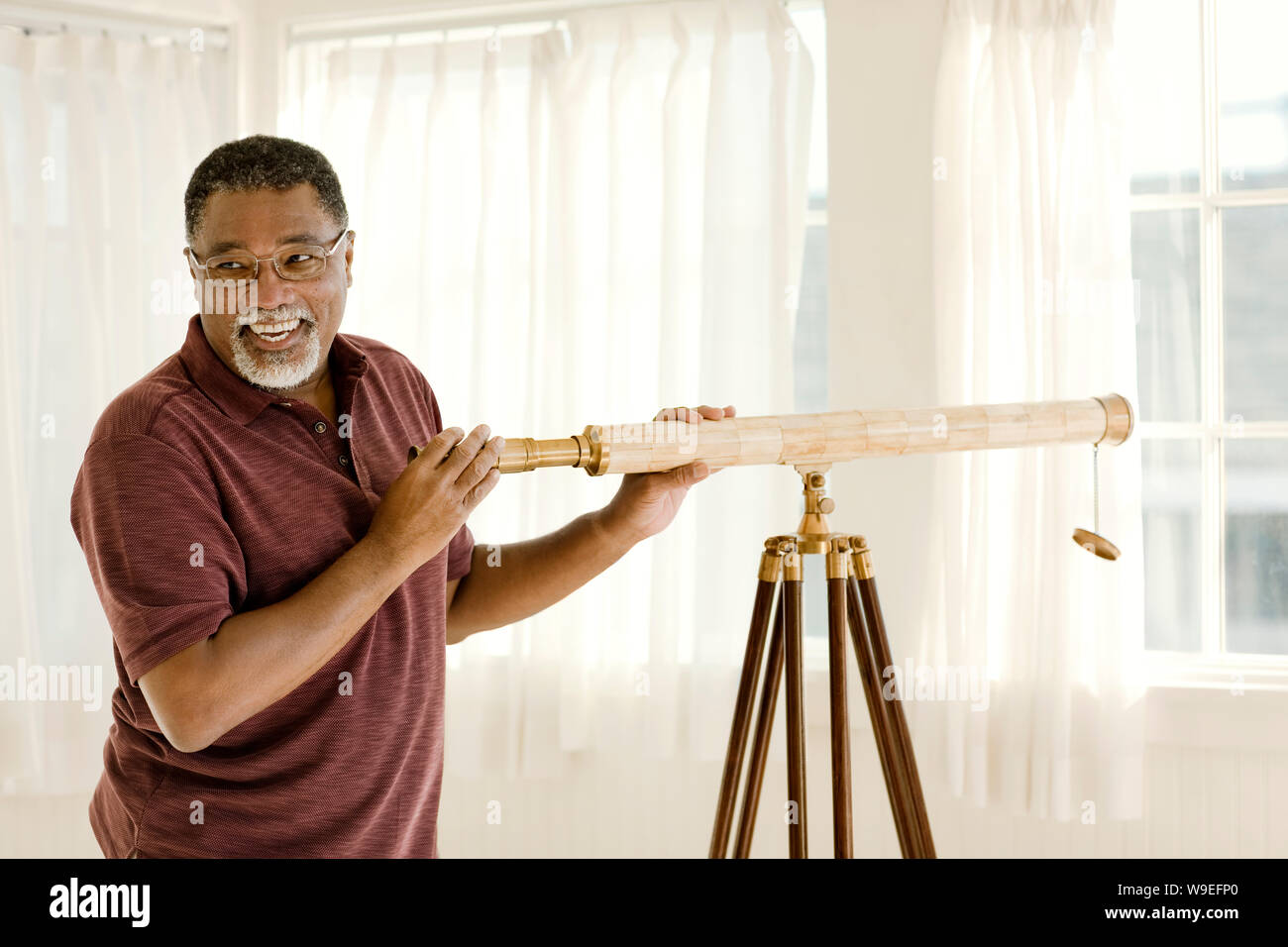 Holding a telescope hi-res stock photography and images - Alamy