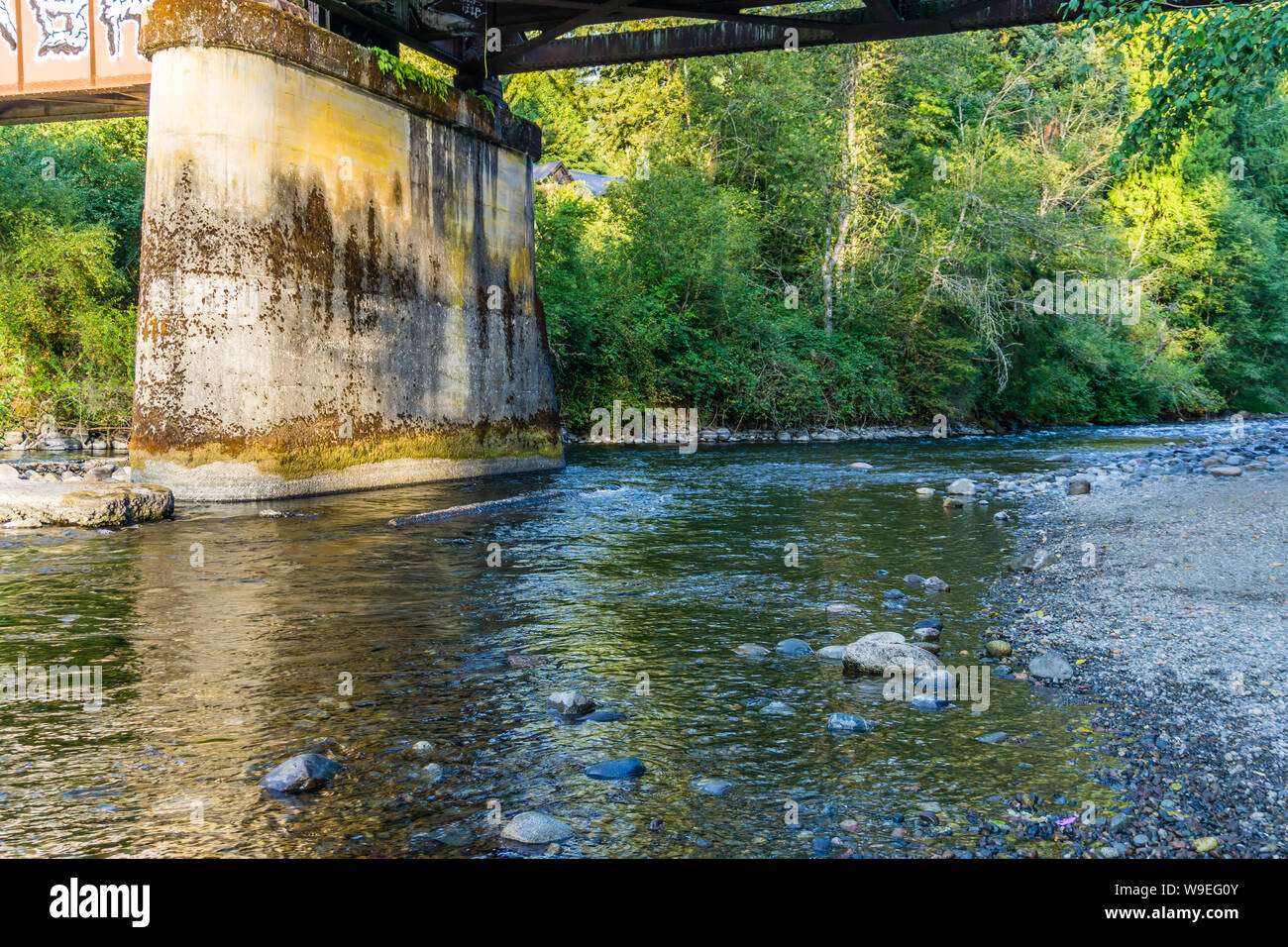 The Cedar River flows beneath a bridge in Maple Valley, Washington ...