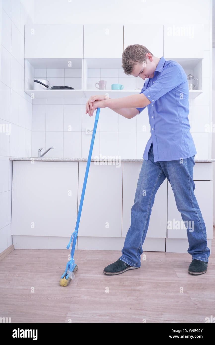 Boy cleaning floor cloth hi-res stock photography and images - Alamy