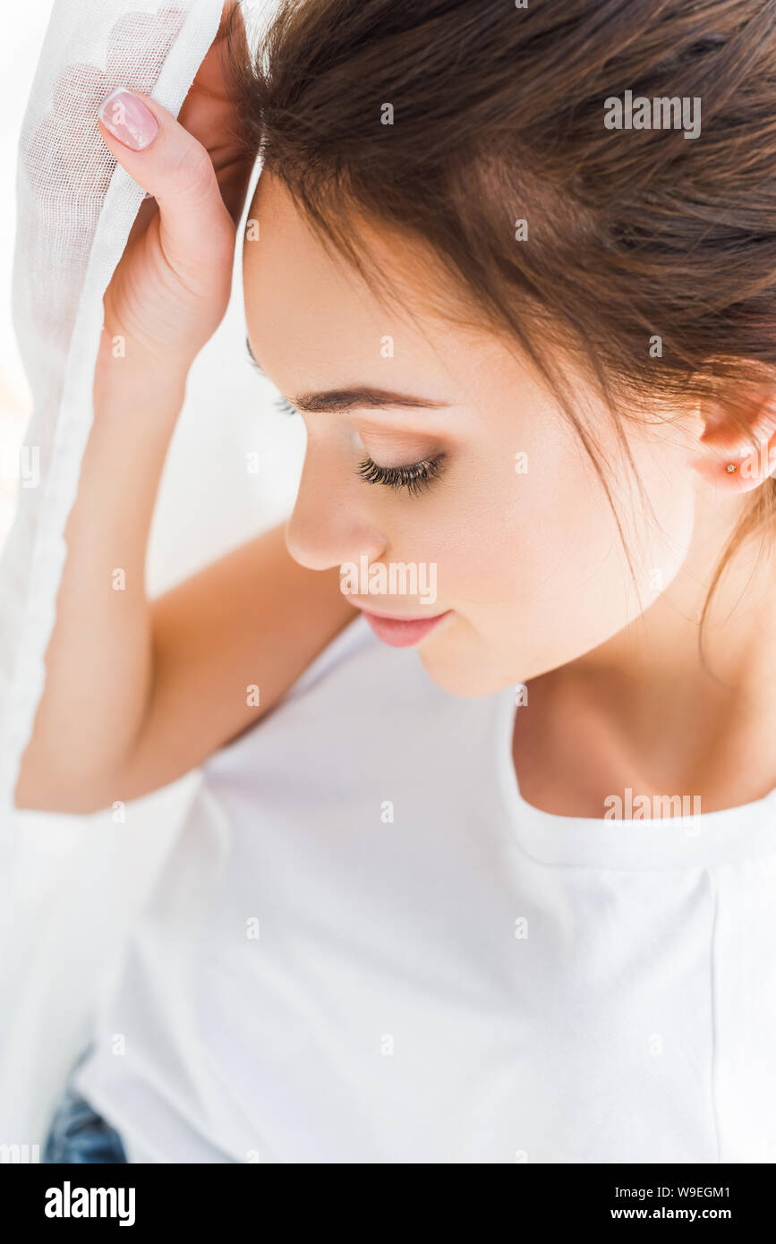 overhead view of pretty young woman in white t-shirt Stock Photo - Alamy