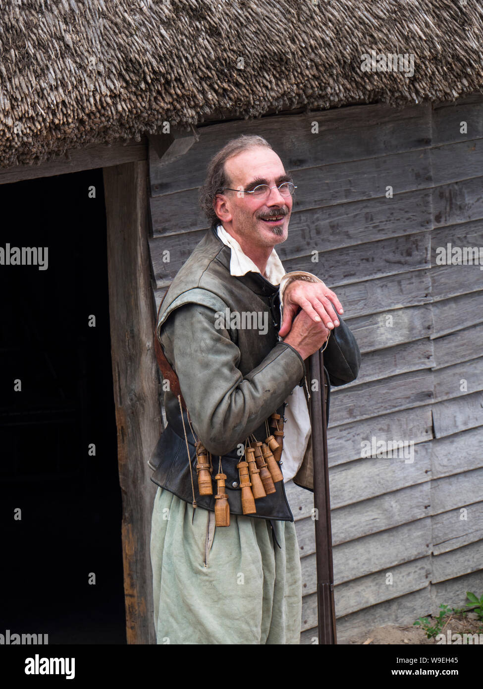 Pilgrim man with his gun and gunpower cases Stock Photo - Alamy