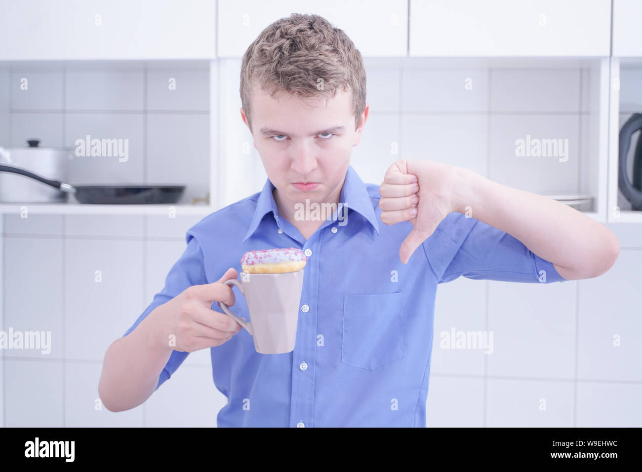preteen handsome boy refuse to eat unhealthy food Stock Photo - Alamy