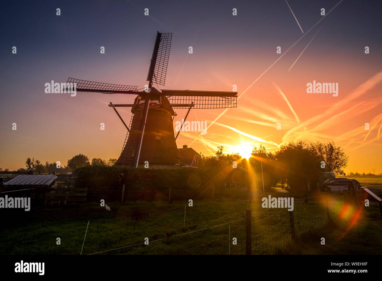 Beautiful sunset in front of windmill, Netherlands Stock Photo - Alamy