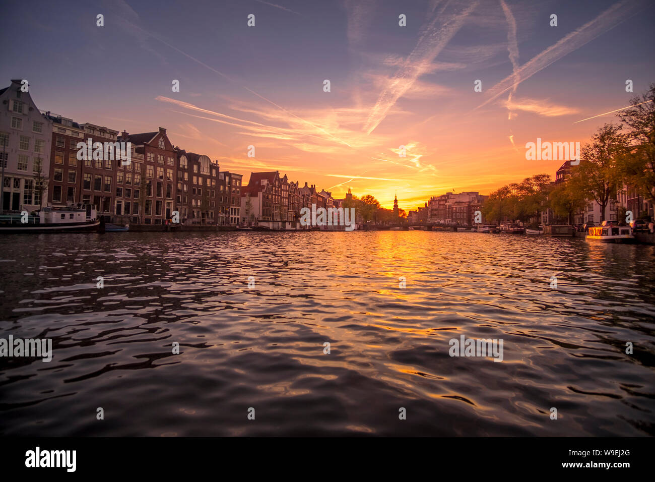 Beautiful sunset on canal in Amsterdam, Netherlands Stock Photo - Alamy