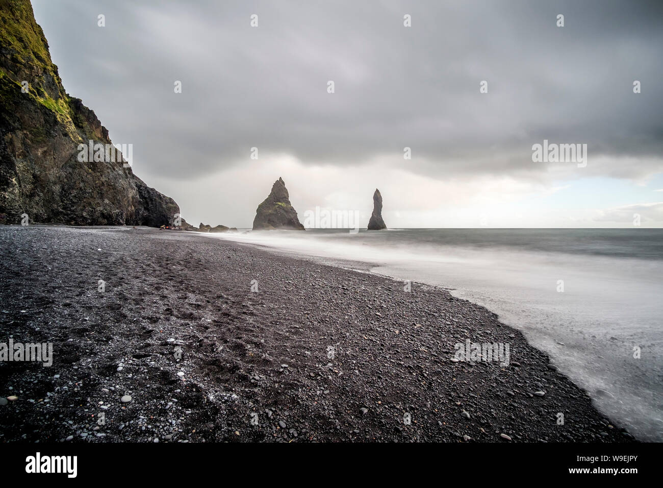 Black sand beach and rock formations "Troll toes". Reynisdrangar, Vik ...