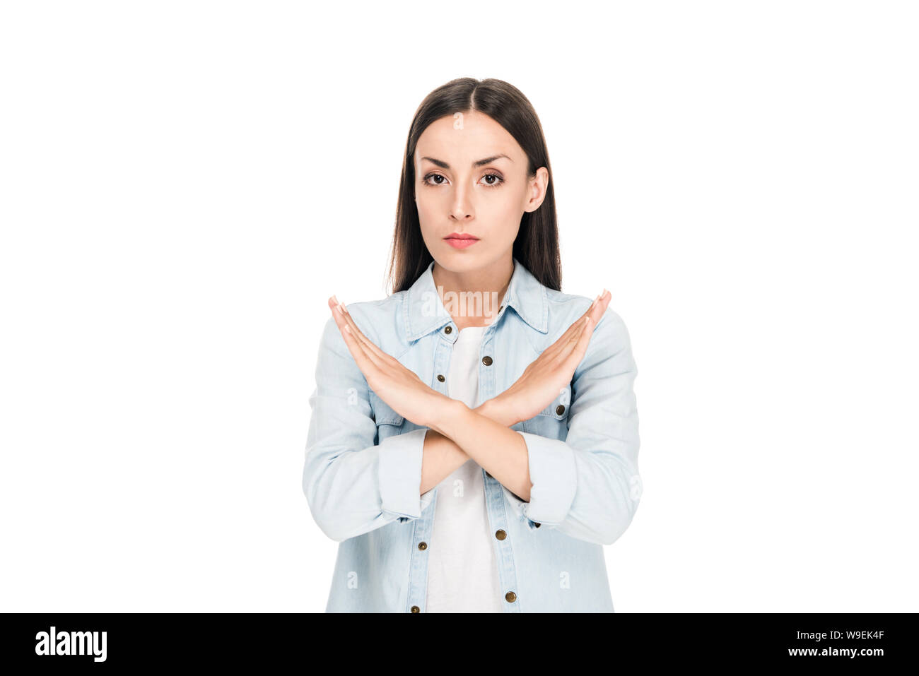 brunette woman showing no sign isolated on white Stock Photo - Alamy