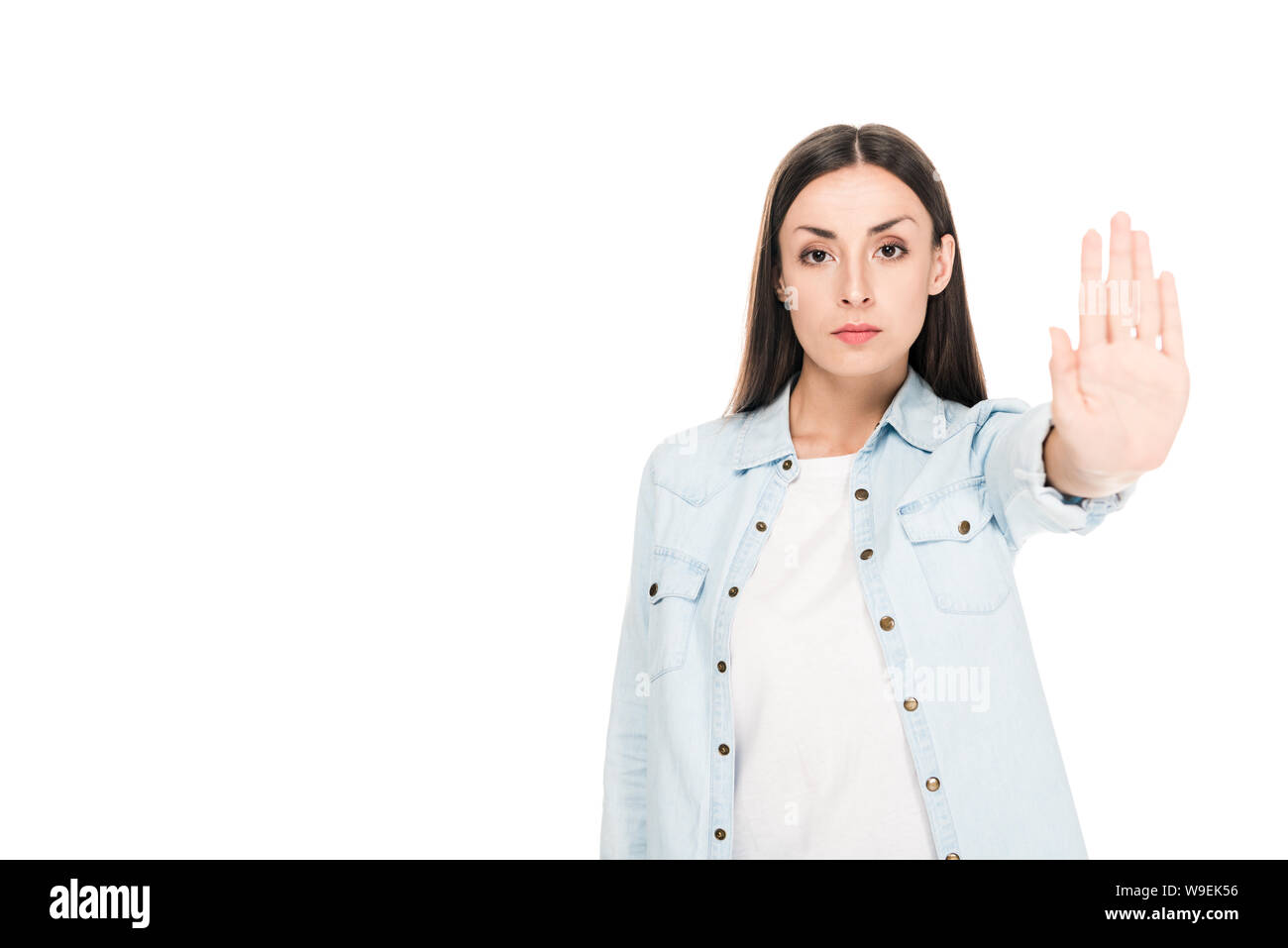 brunette woman showing stop sign isolated on white Stock Photo - Alamy